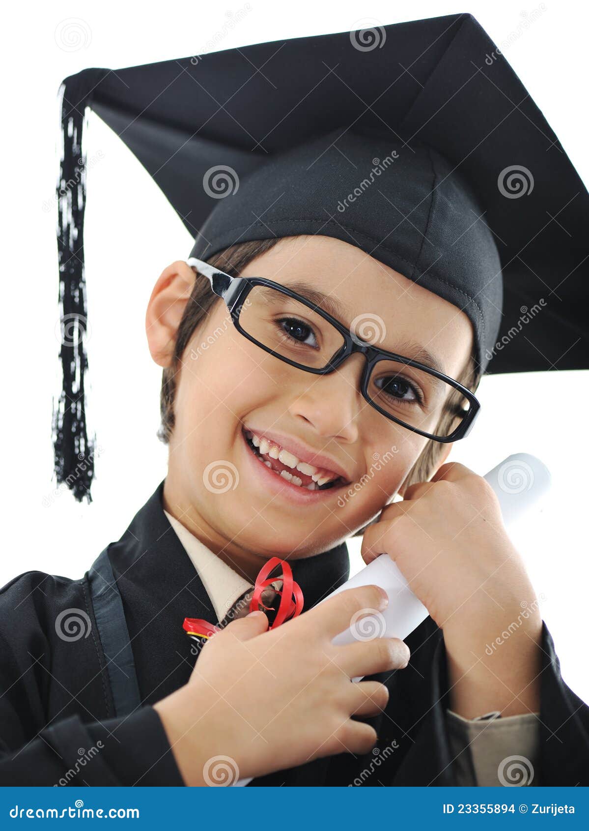 Little Student Girl Sitting At Desk In Classroom And Writing In Her ...