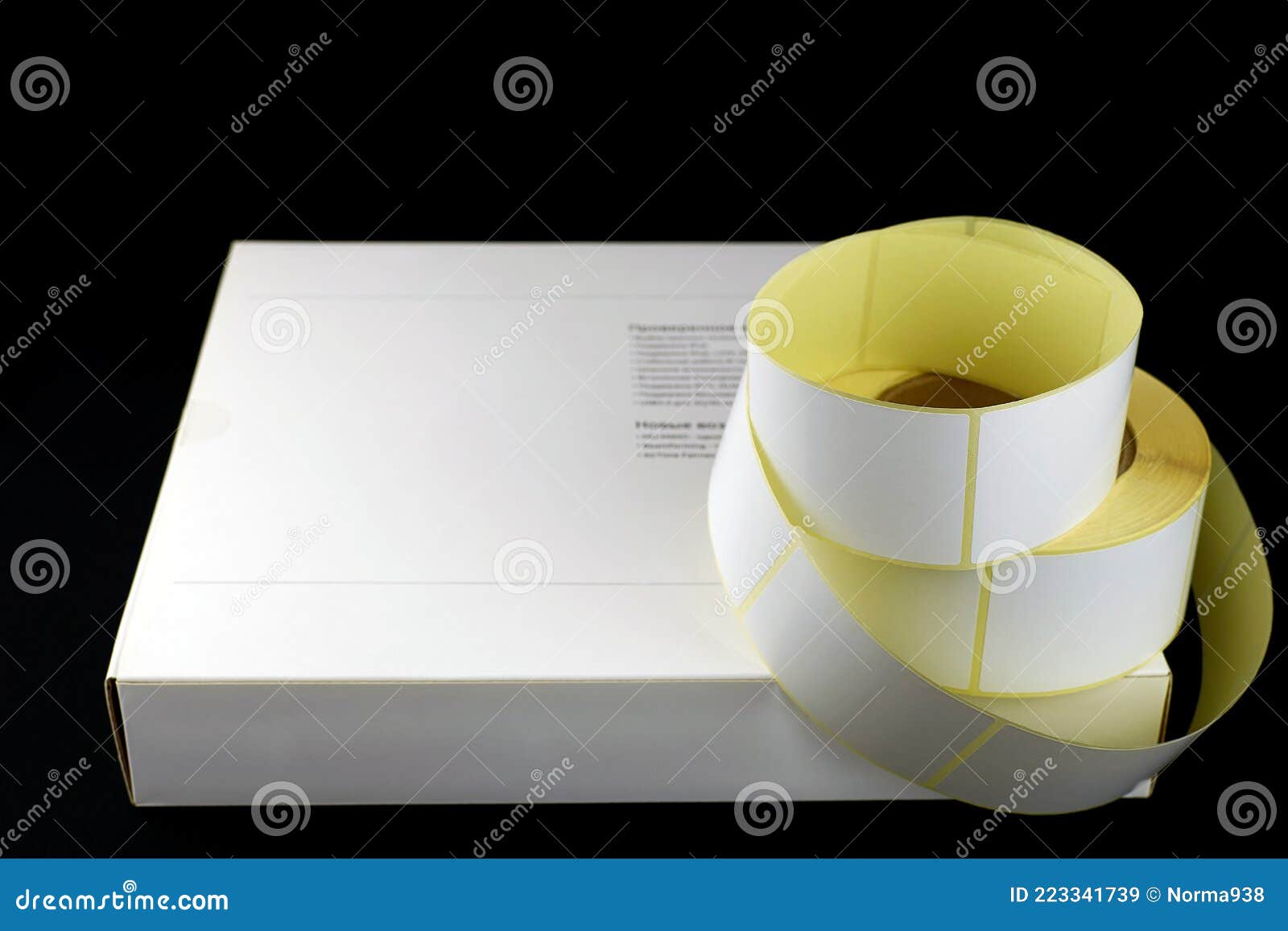 Direct Thermal Perforated Labels on a White Cardboard Box. Roll of ...