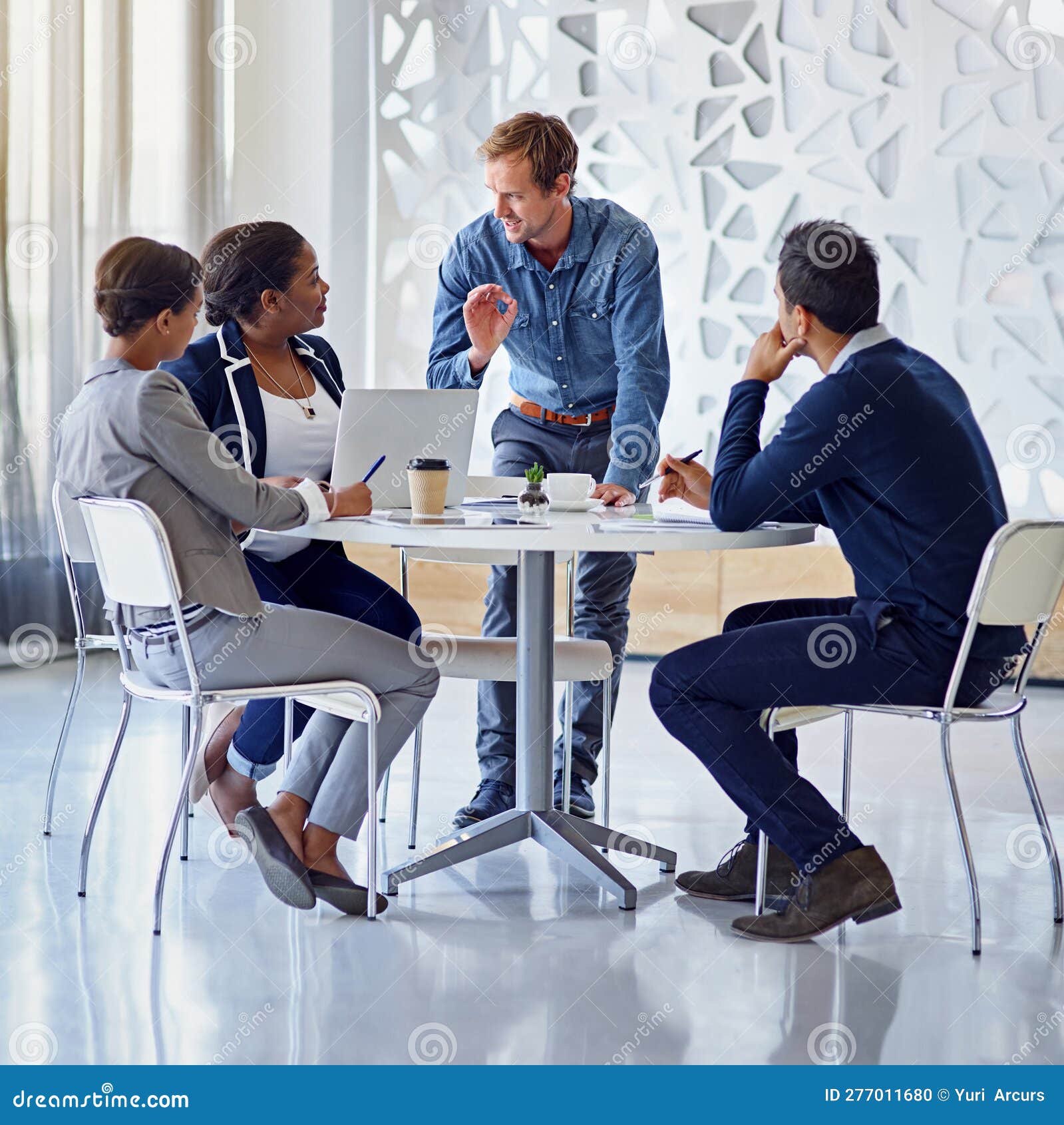 Directing His Team with Efficiency. a Group of Colleagues Working ...