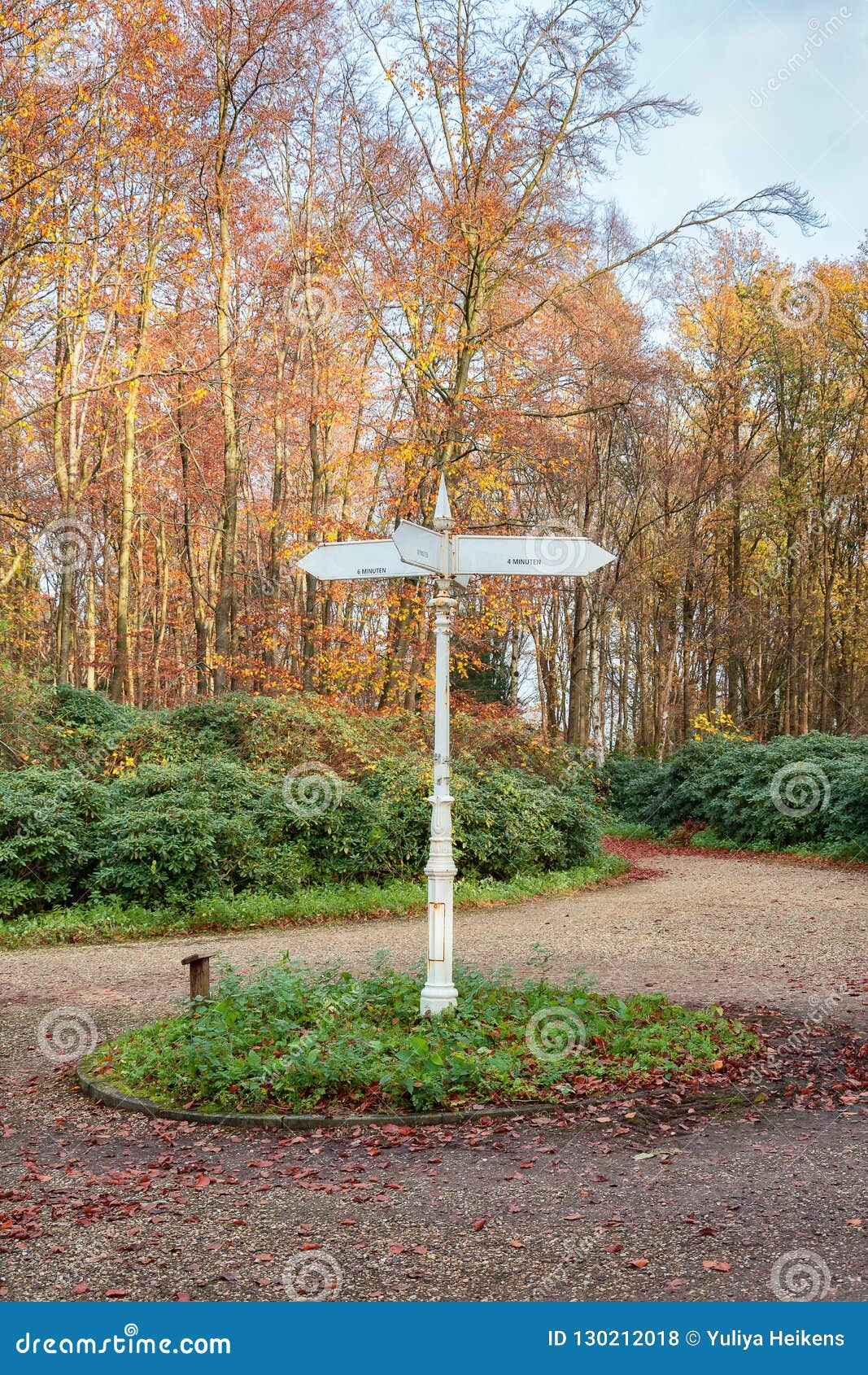 Direction Arrows on a Pole at the Roundabout in the Middle of Th Stock ...