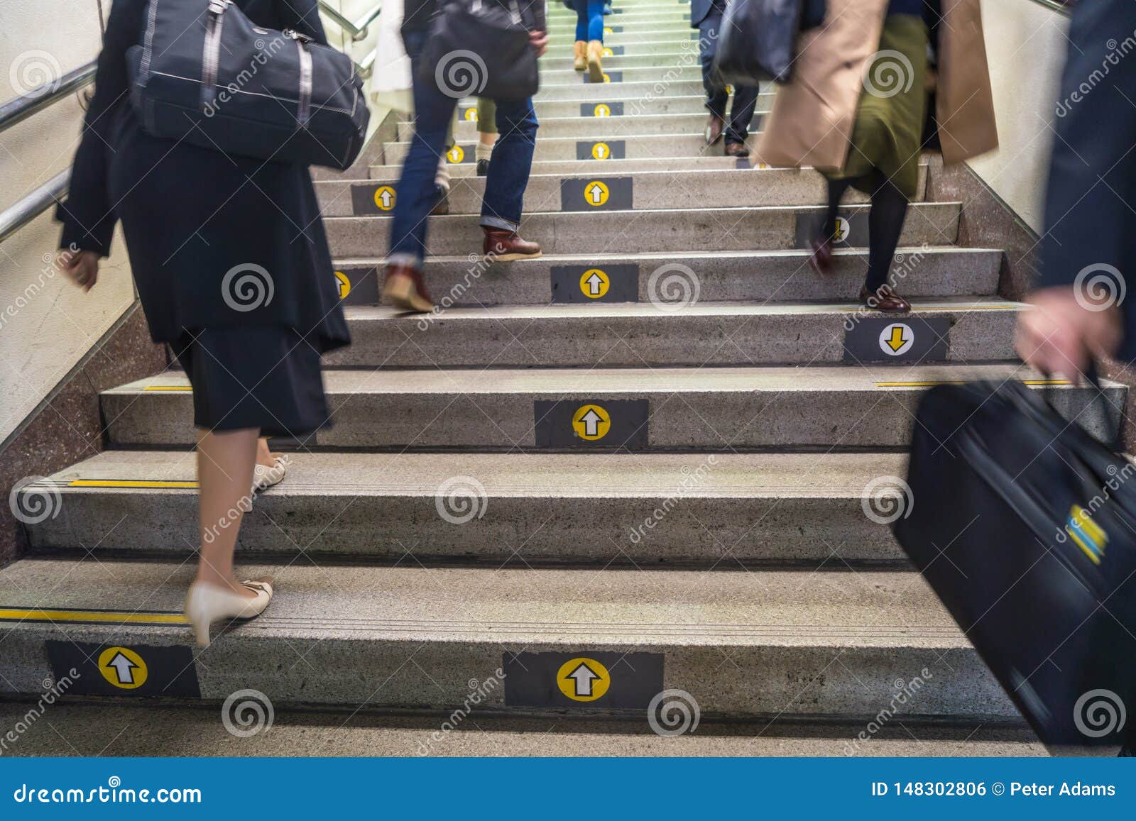 Direction Arrows on Steps on Tokyo Subway with Commuters, Tokyo Stock ...