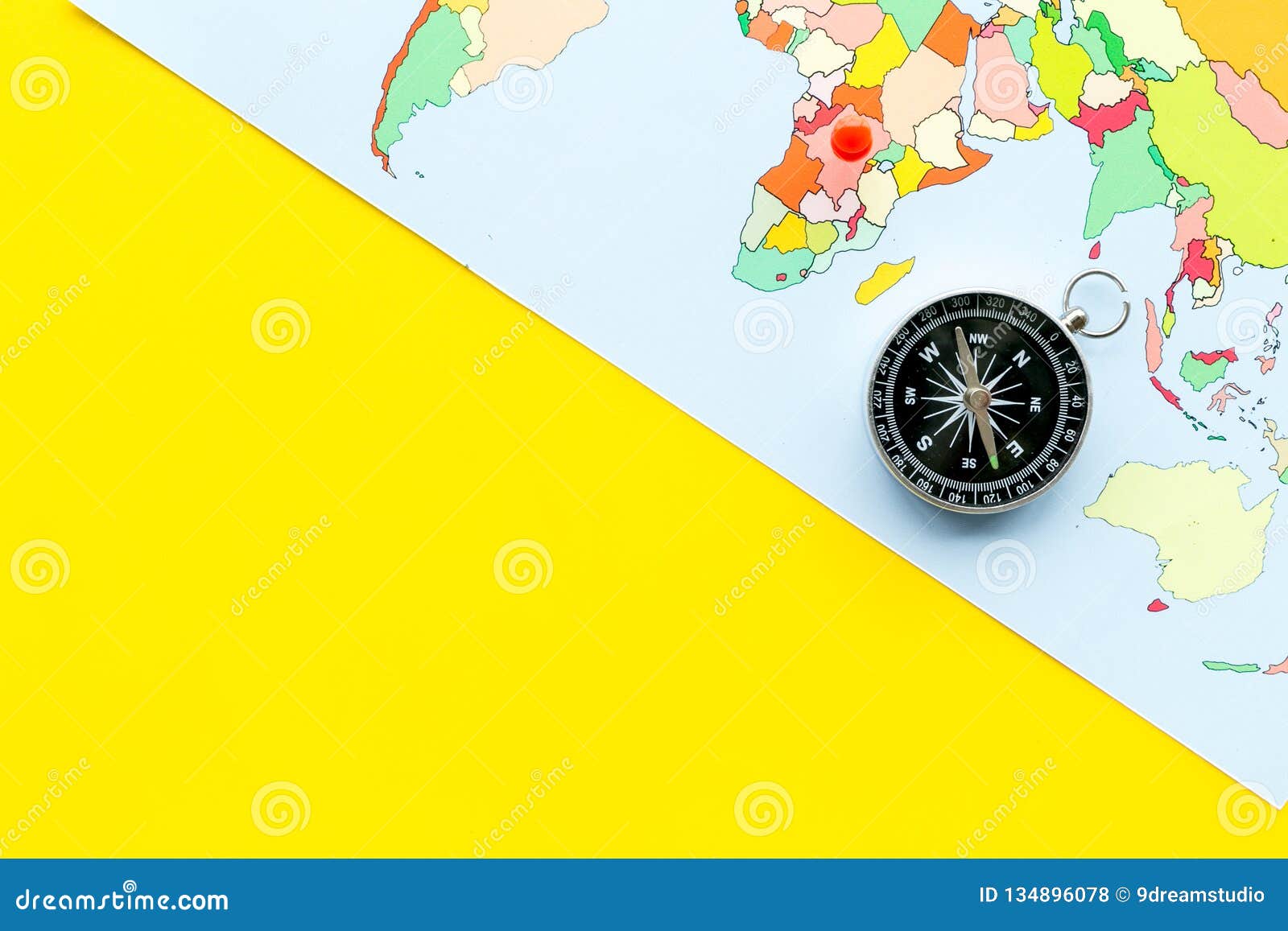 Direction Concept with Compass and Map on Yellow Background Top View ...