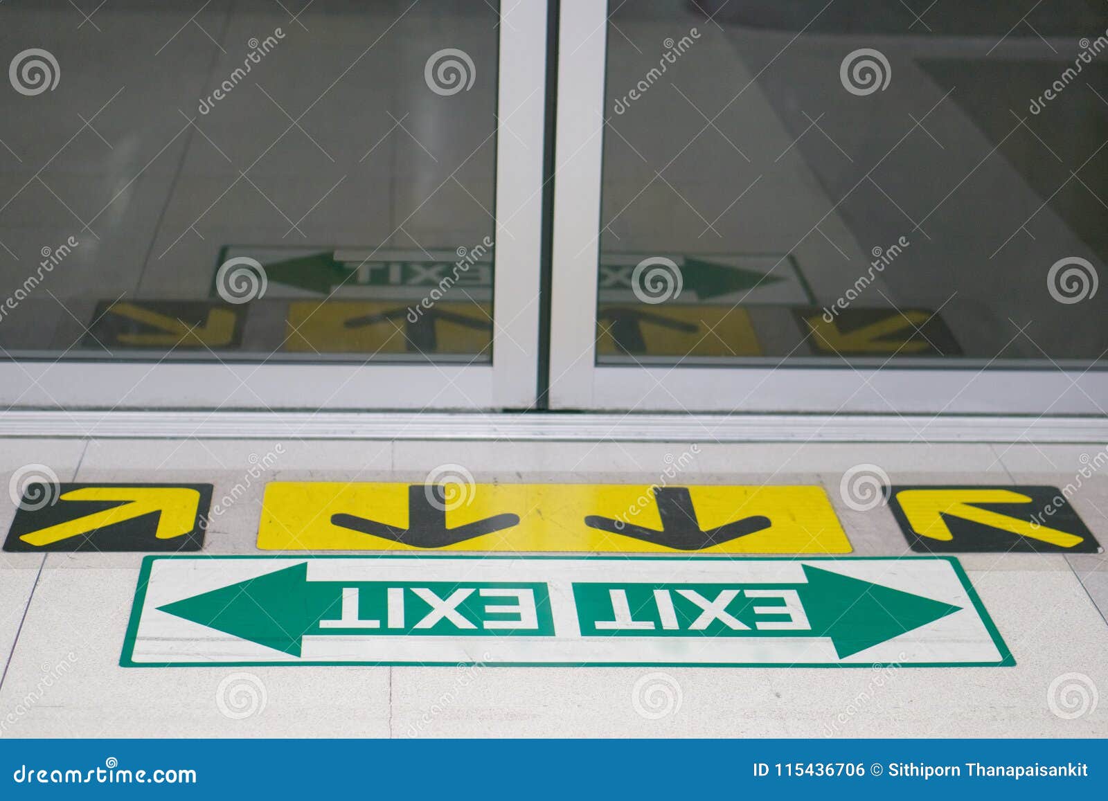 Direction and Exit Arrow Sign at Station with Close Door Stock Photo ...