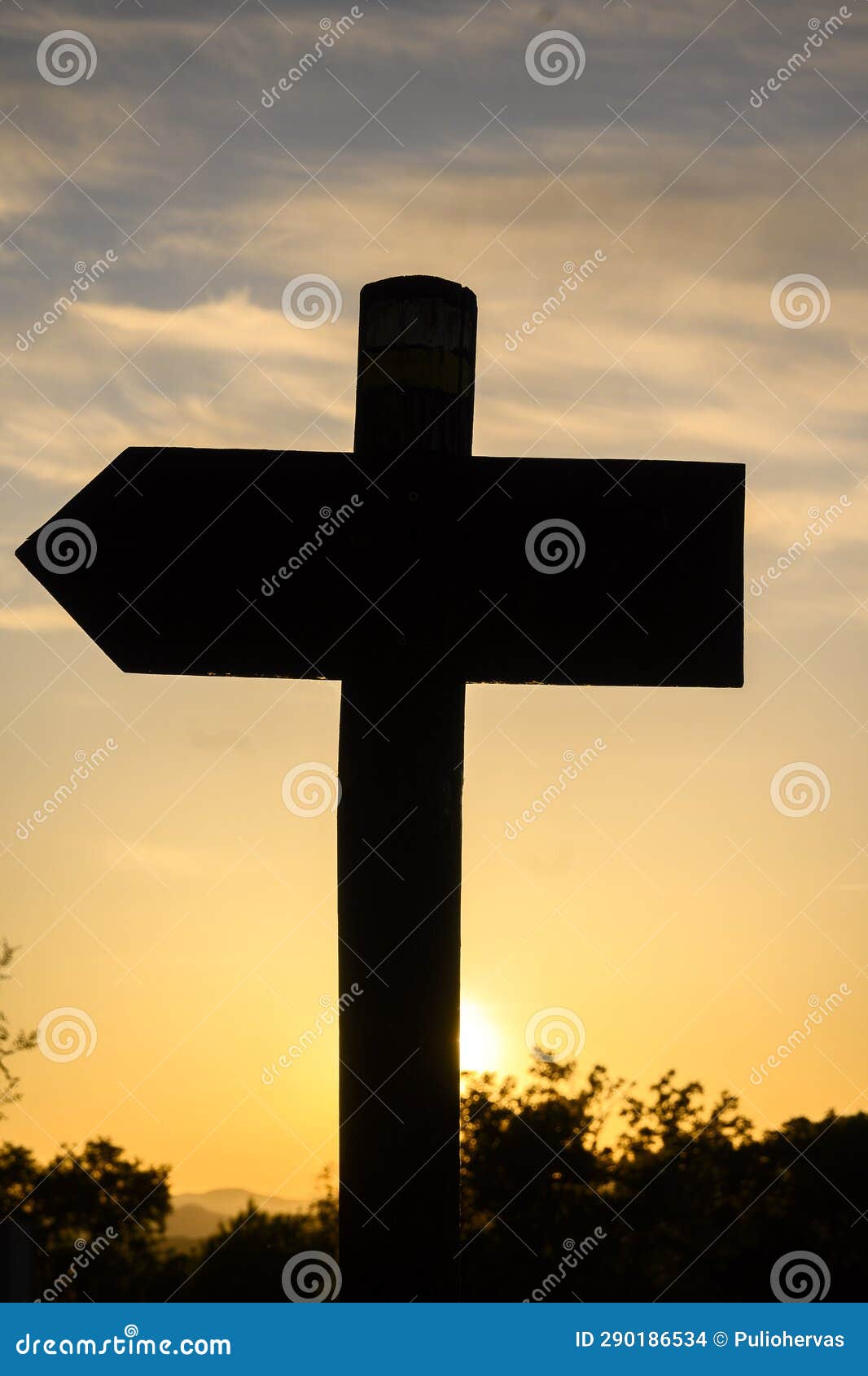 Direction Indicator Sign with Arrow Backlit Silhouette with Orange Sky ...