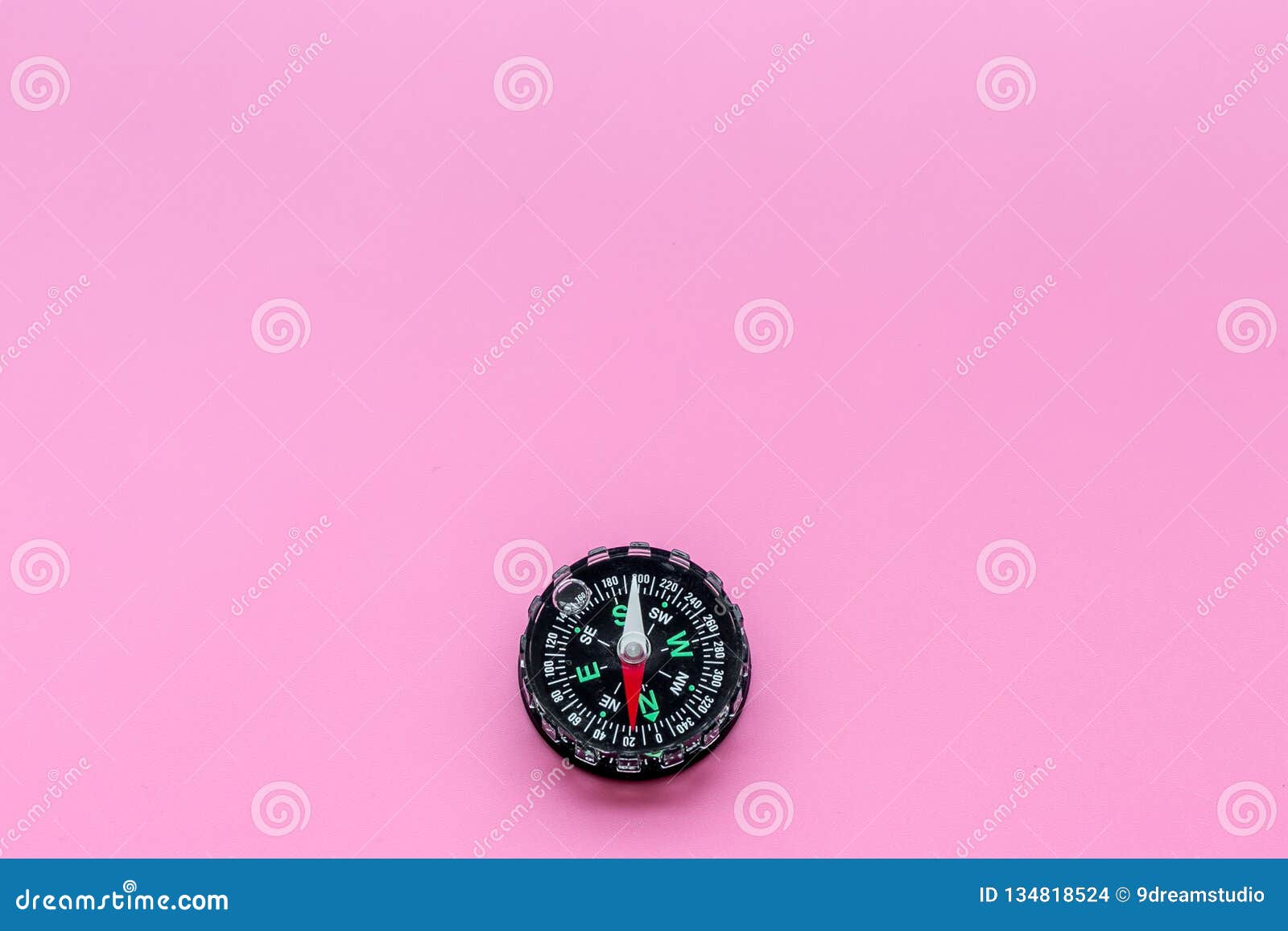 Direction of Movement. Compass on Pink Background Top View Copy Space ...