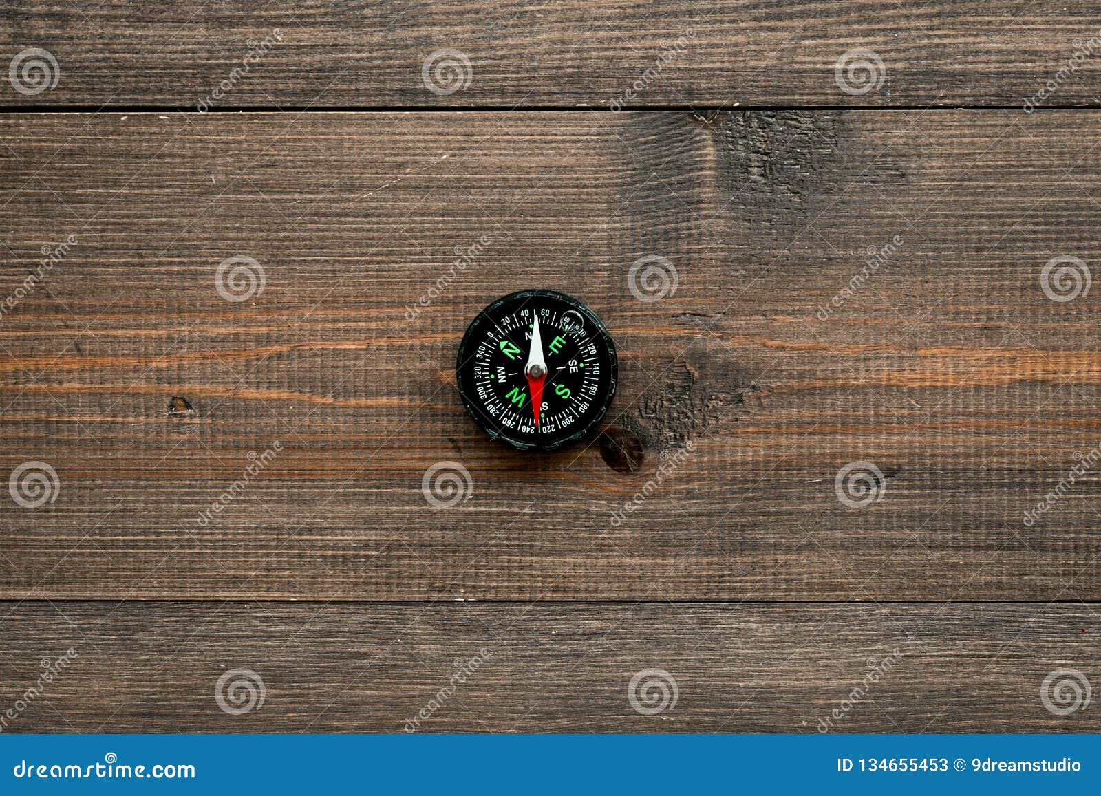 Direction and Movement Concept with Compass on Wooden Background Top ...