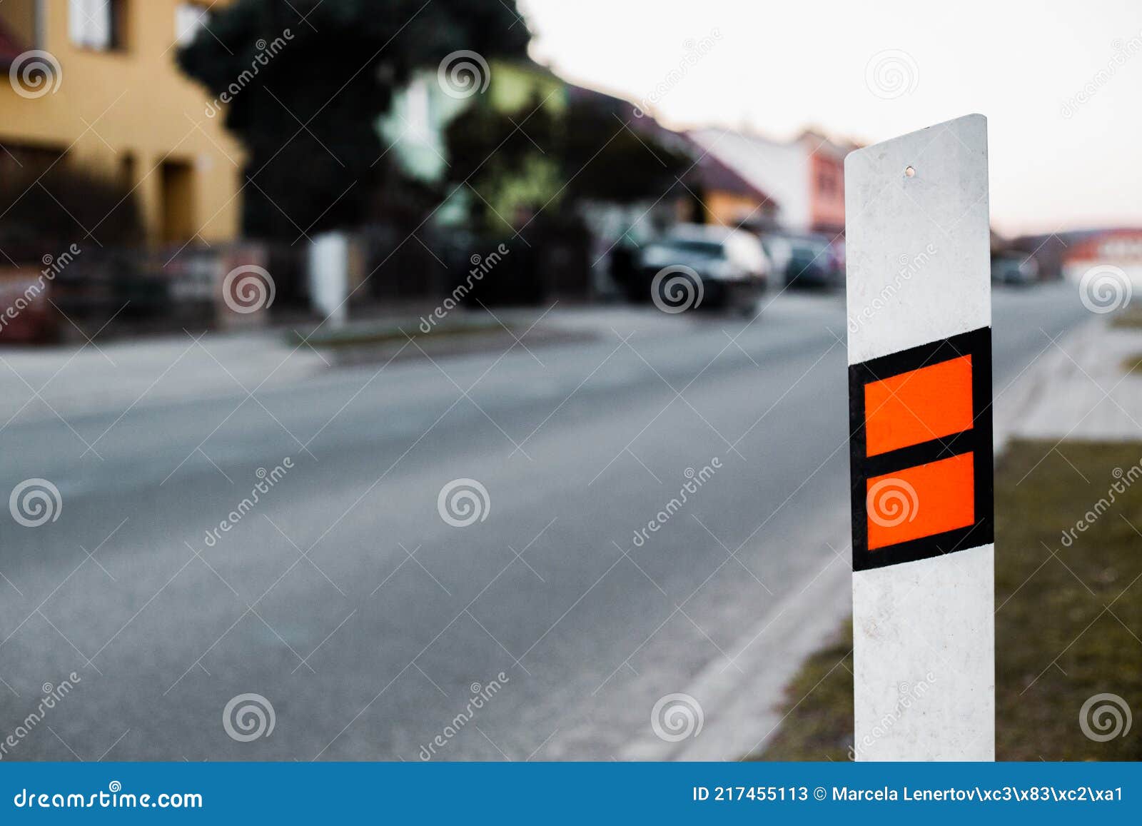 Directional Column with an Orange Reflector on the Side of the Road ...