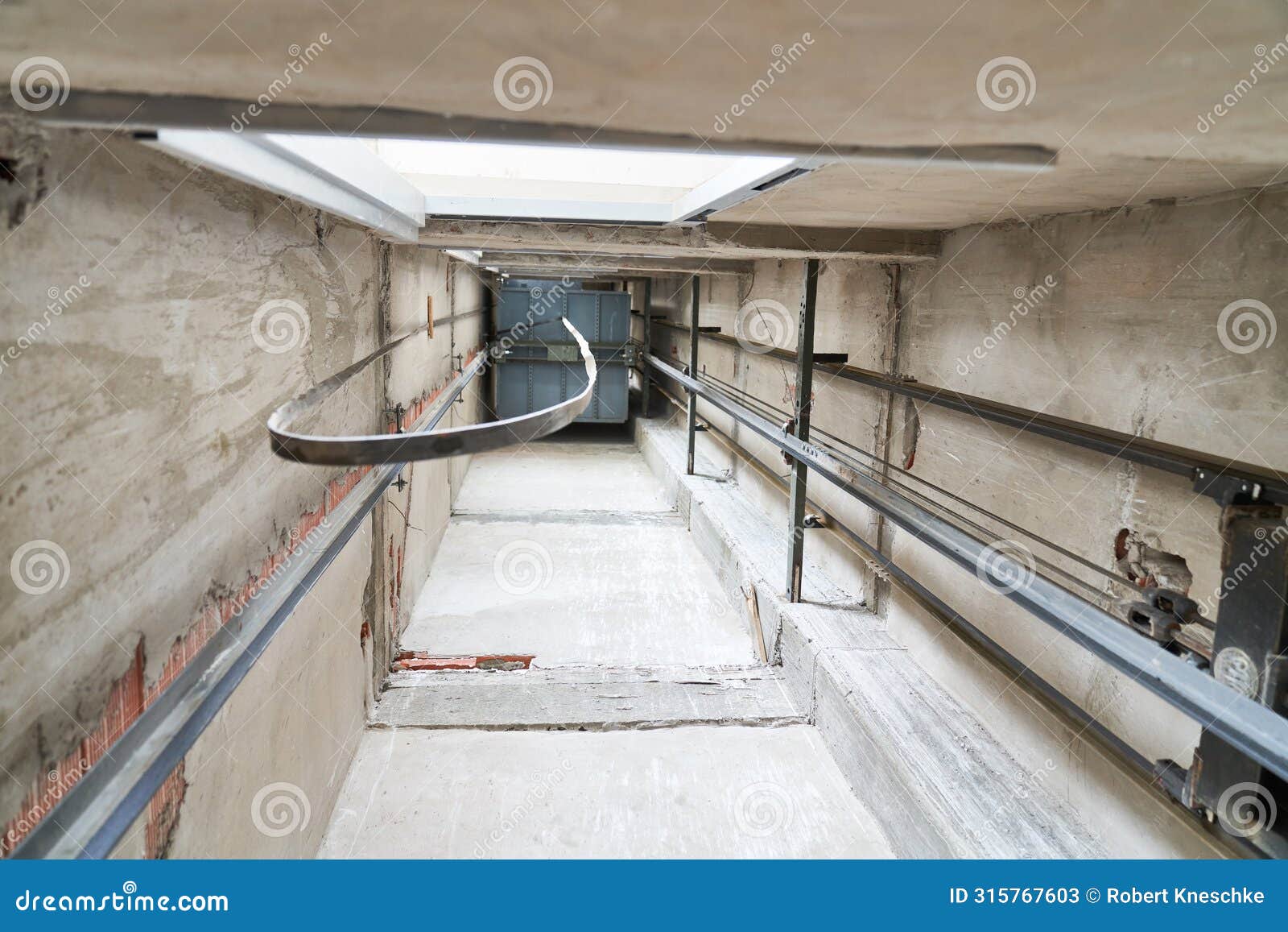 Directly Below View of Illuminated Elevator Shaft Inside Incomplete ...
