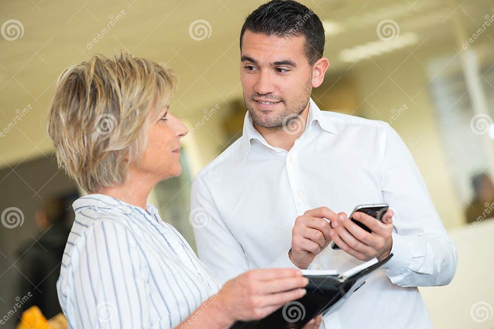 Directors Assistant Talking To Boss Stock Photo - Image of subordinate ...