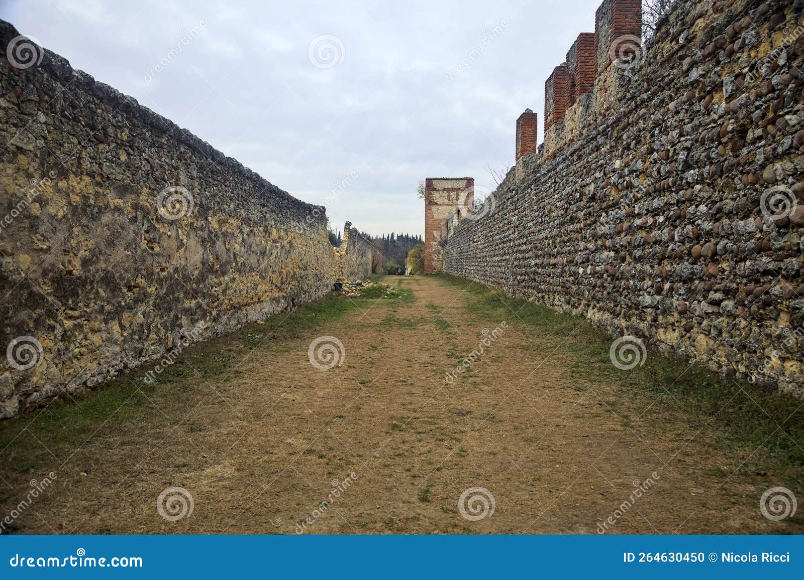 Dirt Path Bordered by Fortifications in a Park on a Cloudy Day Stock ...