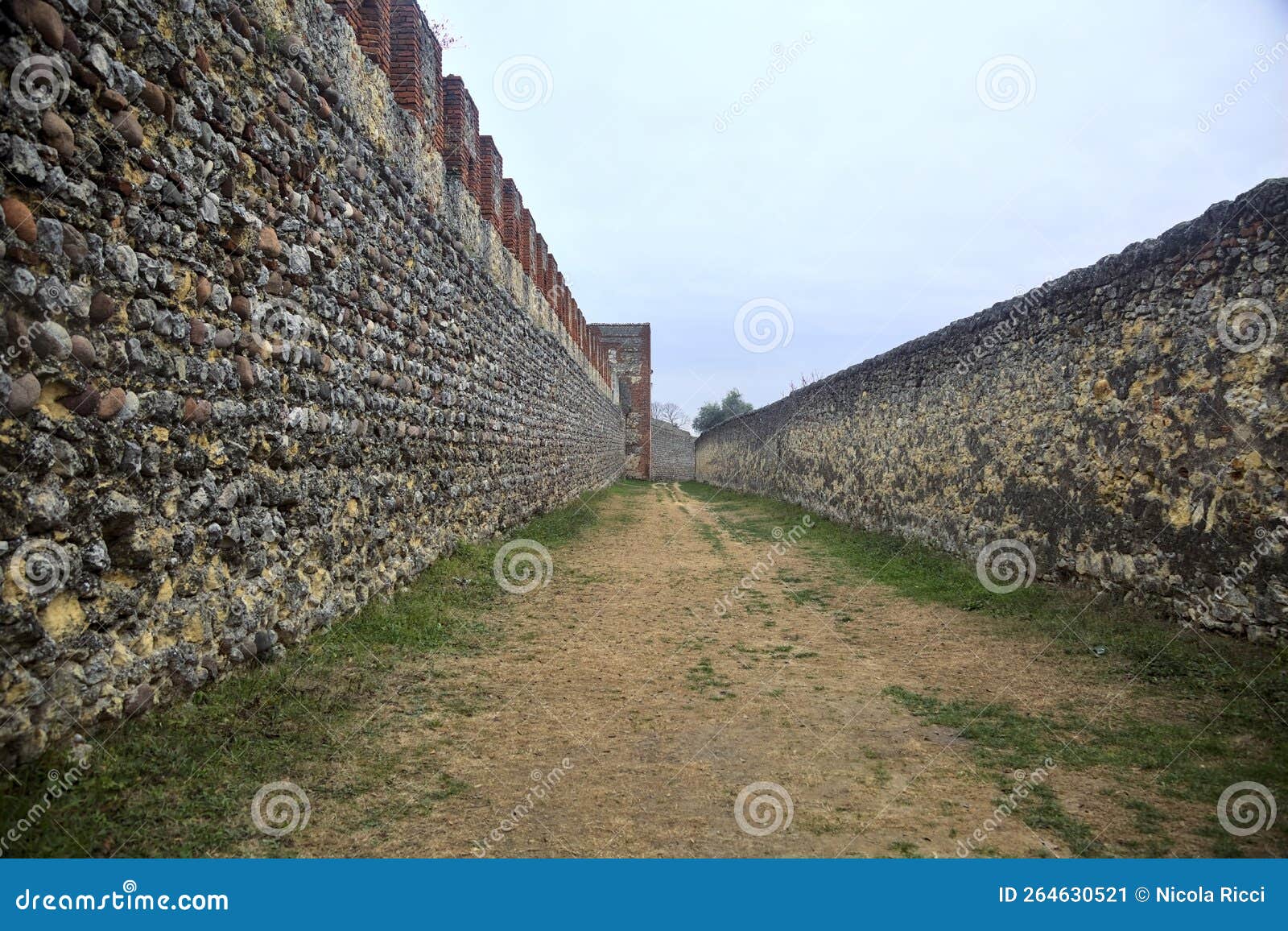 Dirt Path Bordered by Fortifications in a Park on a Cloudy Day Stock ...