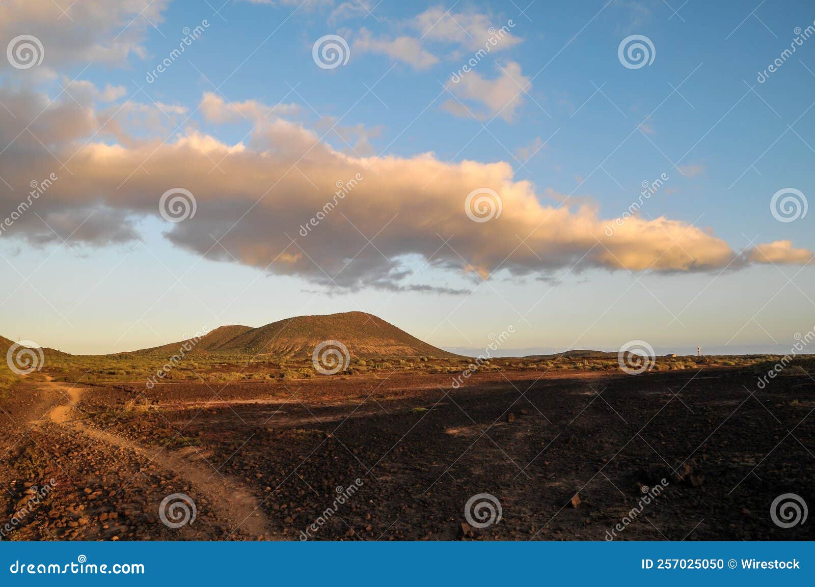 Dirt Road through a Deserted Landscape at Sunset Stock Photo - Image of ...
