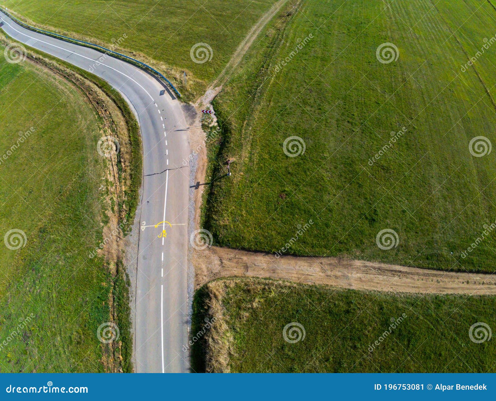 Dirt Road Intersecting the Asphalt Road Drone View, Simple Catholic ...