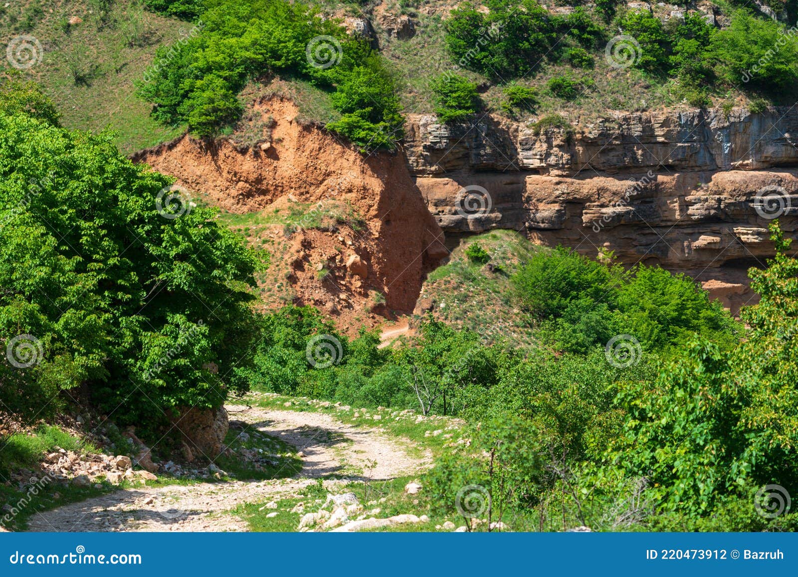 Dirt road between rocks stock photo. Image of nature - 220473912