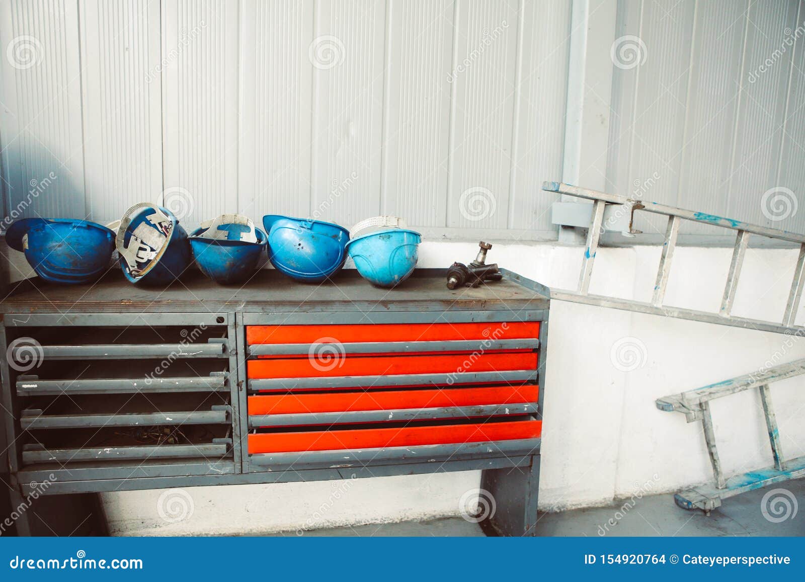 Dirty Blue Worker Helmets on Top of an Old, Rusty and Dirty Workbench ...