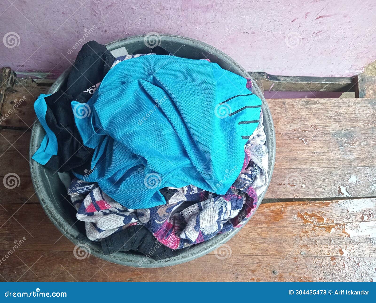 Dirty Clothes Placed in a Round Bucket for Washing Stock Photo - Image ...