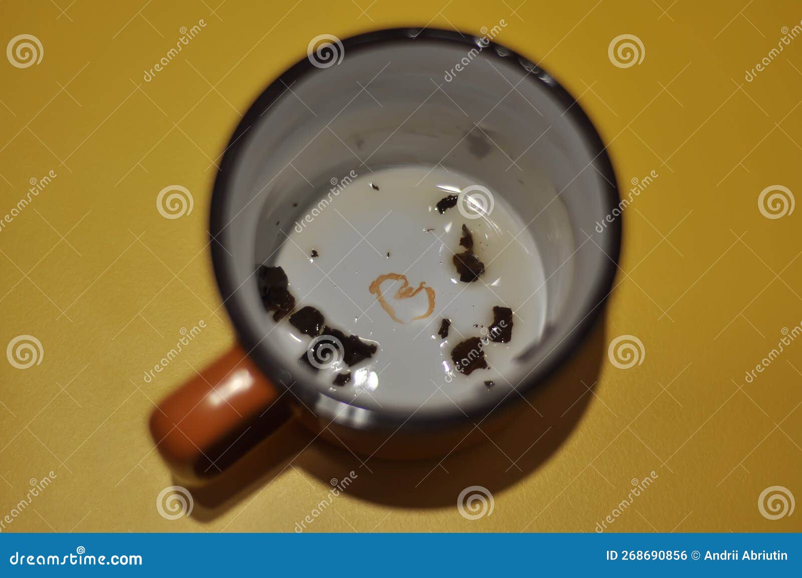 A Dirty Cup after Drinking Tea with Leaves on the Bottom. Orange Color ...