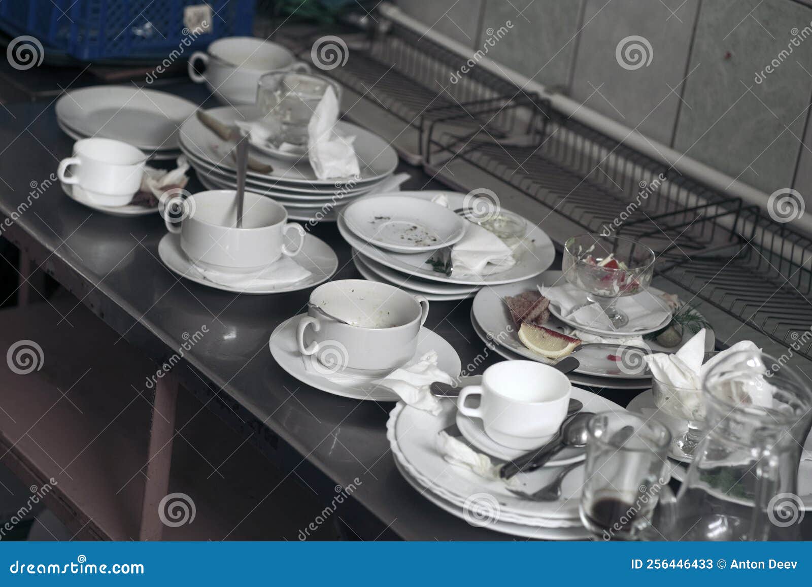 Dirty Cups and Plates with Leftovers and Silverware Placed on Metal ...