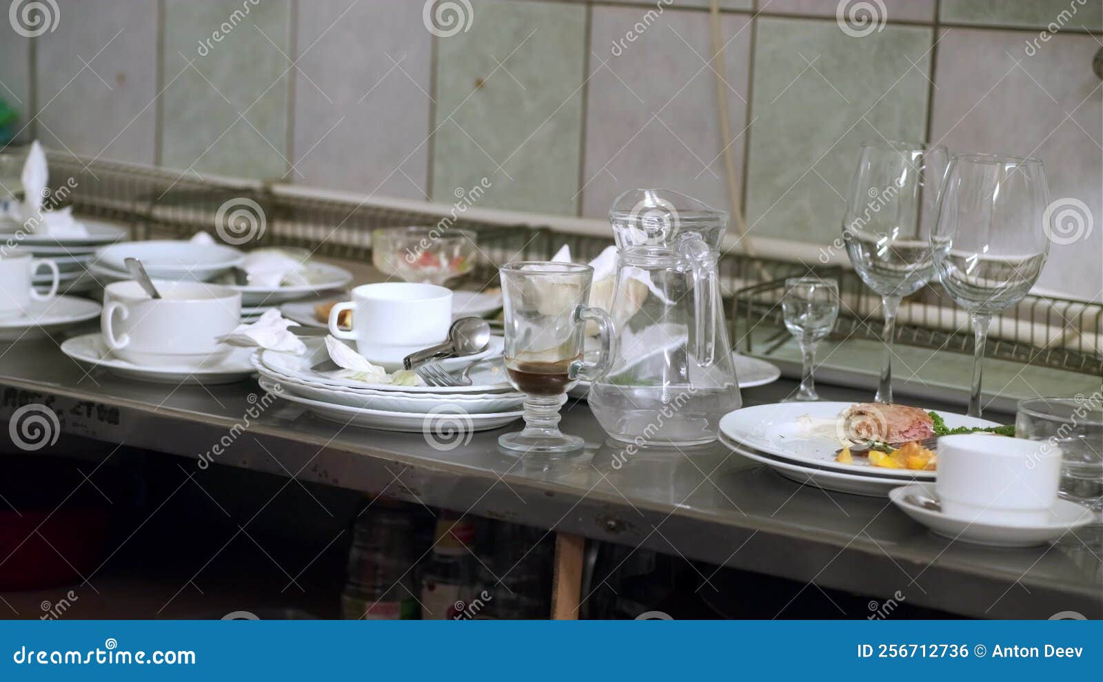 Dirty Dishware on Metal Table. Dirty Cups and Plates with Leftovers and ...