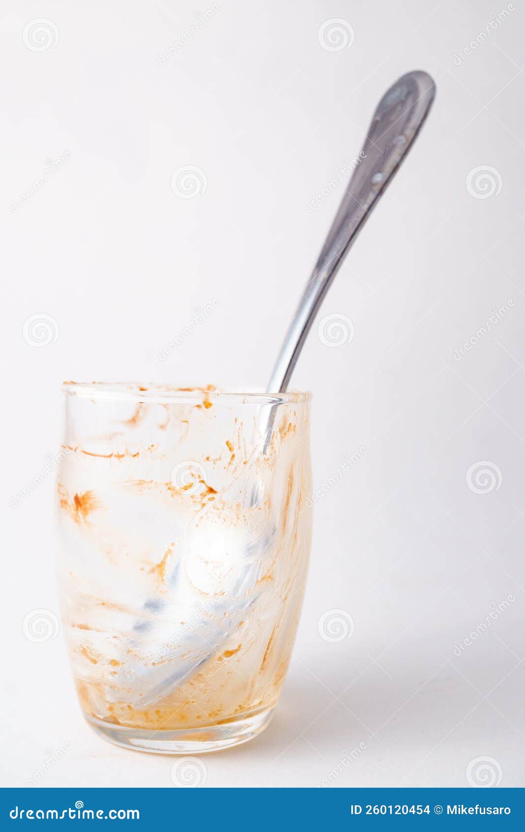 Dirty empty cup and spoon stock photo. Image of syrup - 260120454