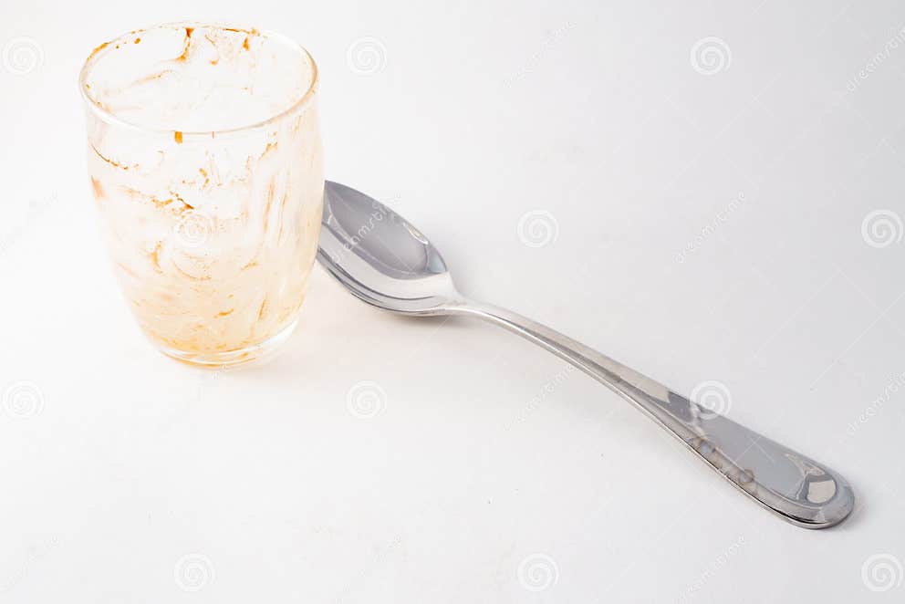 Dirty empty cup and spoon stock image. Image of scoop - 260120459