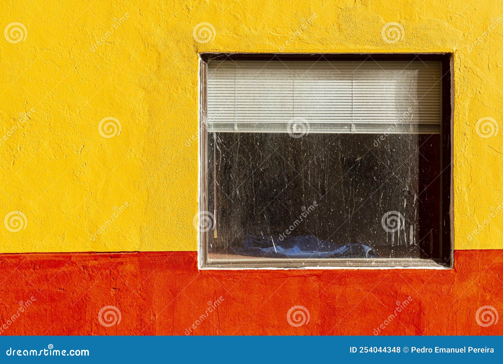 Dirty Glass Window on a Bright Red and Yellow Wall Stock Photo - Image ...