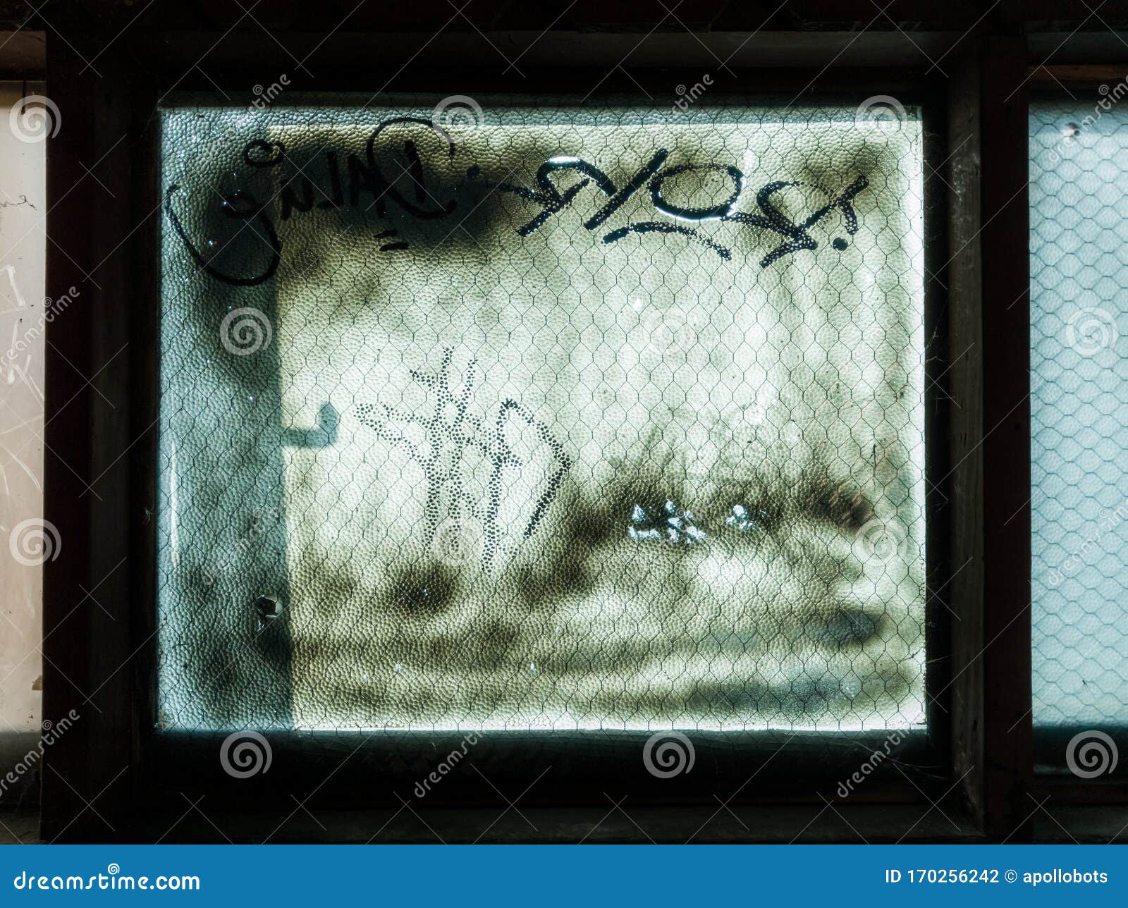 Graffiti On A Window In The City. Blury Buildings At The Background ...