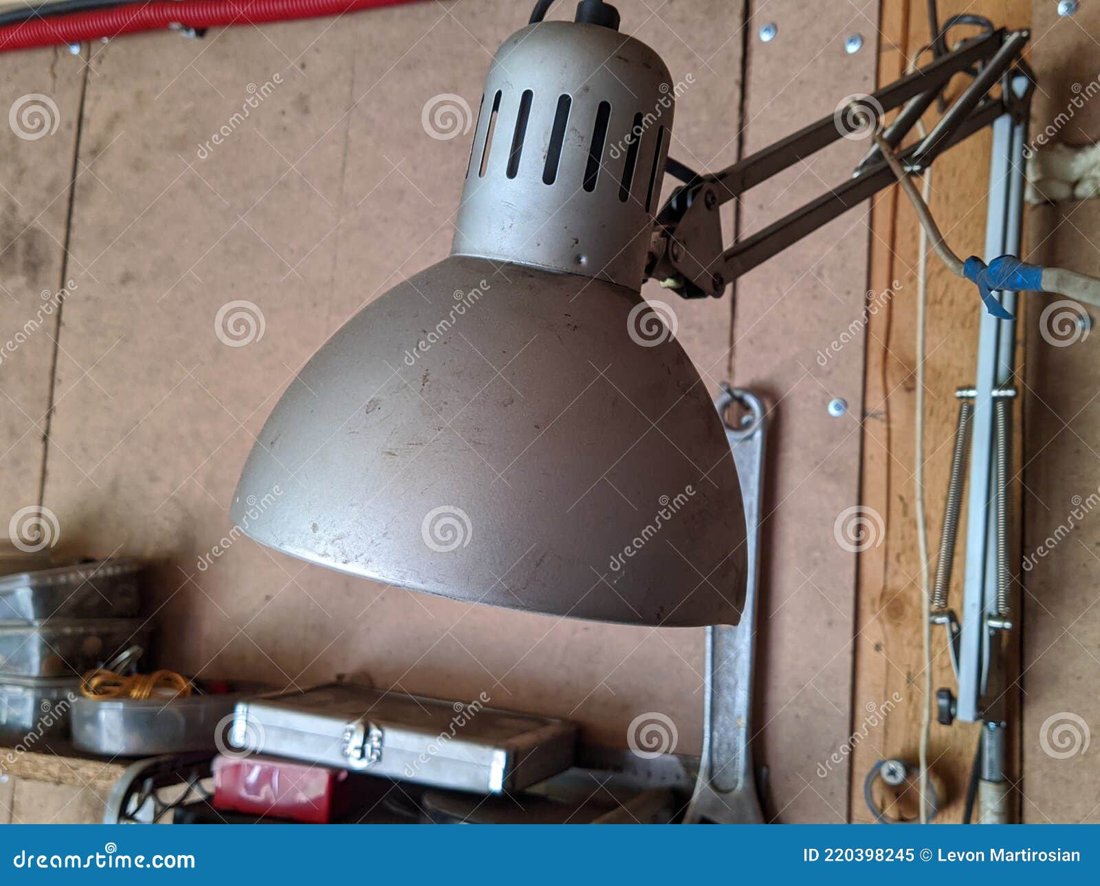 Dirty Lamp in a Working Workshop Against the Background of Tools Stock ...