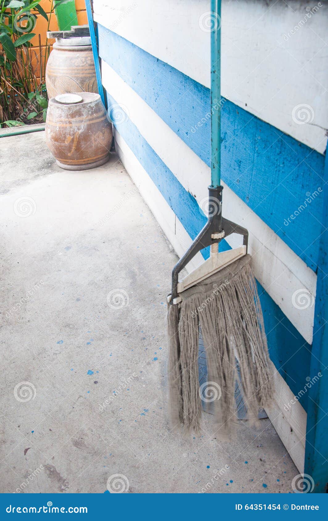 Dirty Old Mops Against Blue Stock Photo - Image of washing, wood: 64351454
