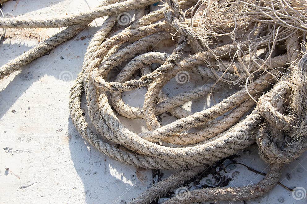 Dirty rope on ground stock photo. Image of ground, textile - 87431324