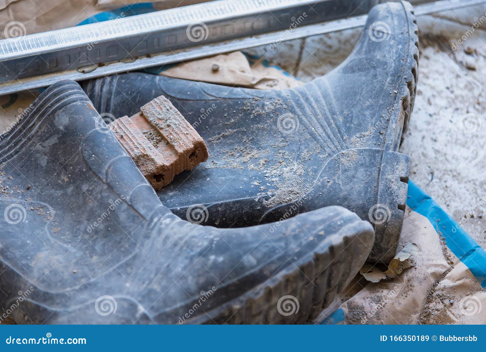Dirty Rubber Boots of Workers in the Construction Site Stock Image ...