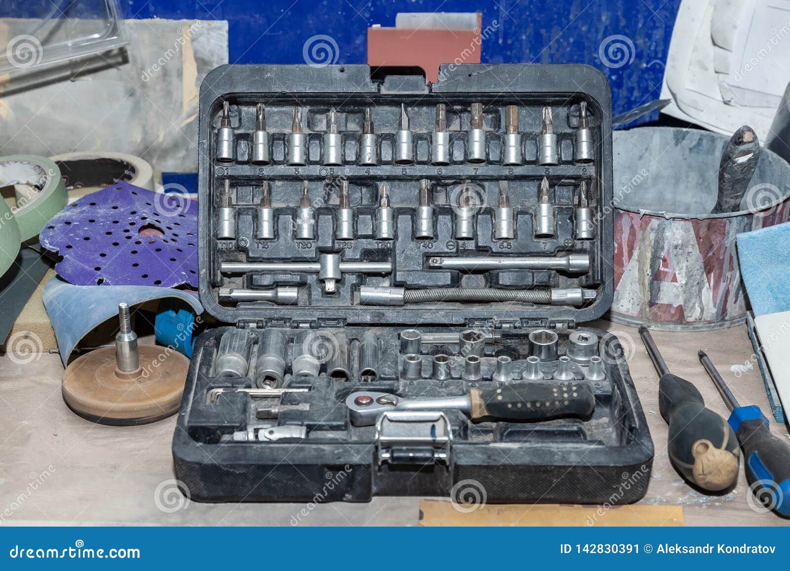 Dirty Set of Tools in a Box with Wrenches and Various Attachments for ...