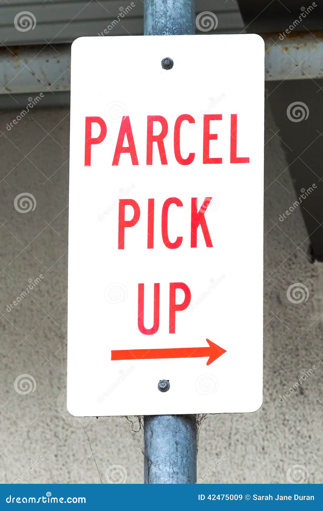 Dirty Sign Stating PARCEL PICK UP with Right Arrow Stock Image - Image ...