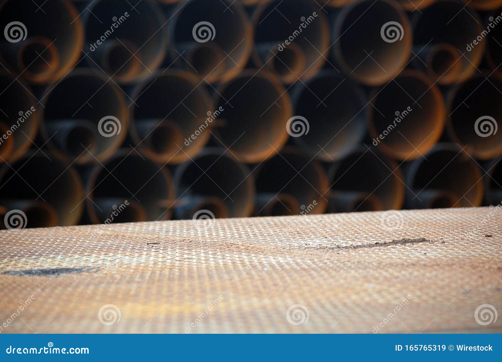 Dirty Steel Table with a Rusty Steel Casing Pipes on the Background 库存 ...