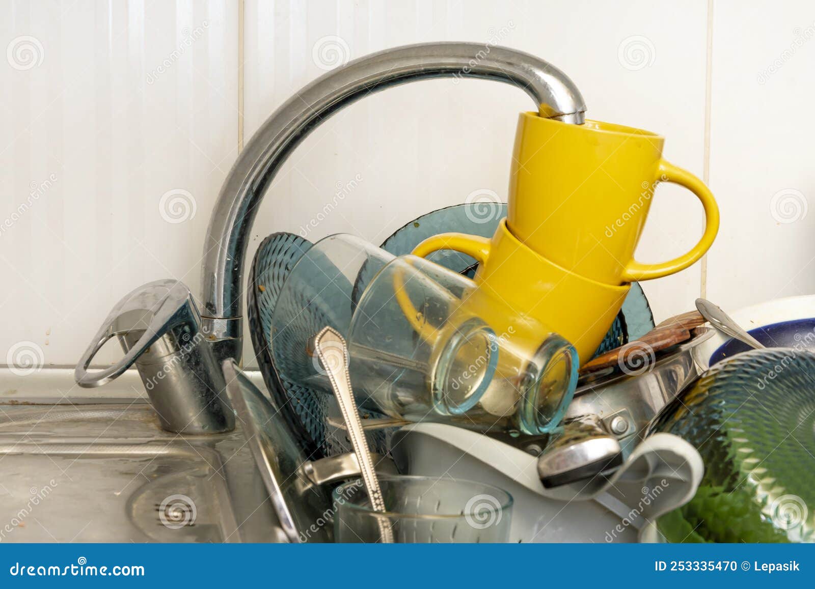 Dirty and Unwashed Dishes are Stacked in the Kitchen Sink. a Mountain ...