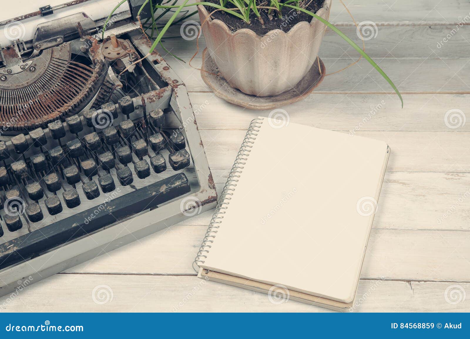 Dirty Vintage Typewriter with Plant and Blank Notebook Stock Image ...