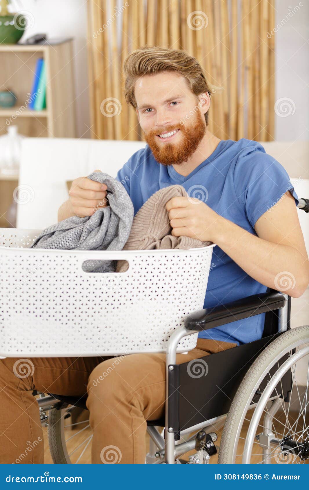 Disable man doing laundry stock photo. Image of confidence - 308149836