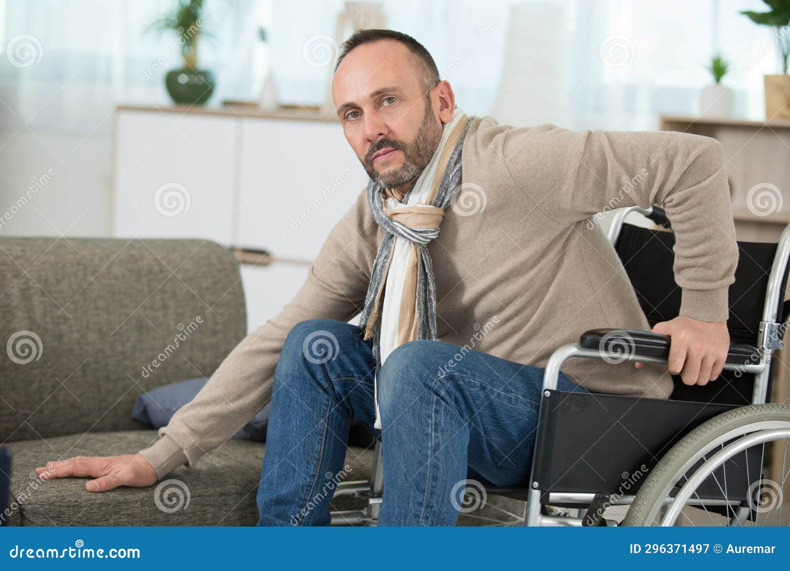Disable Man Tries To Sit on Sofa Stock Image - Image of access, injured ...