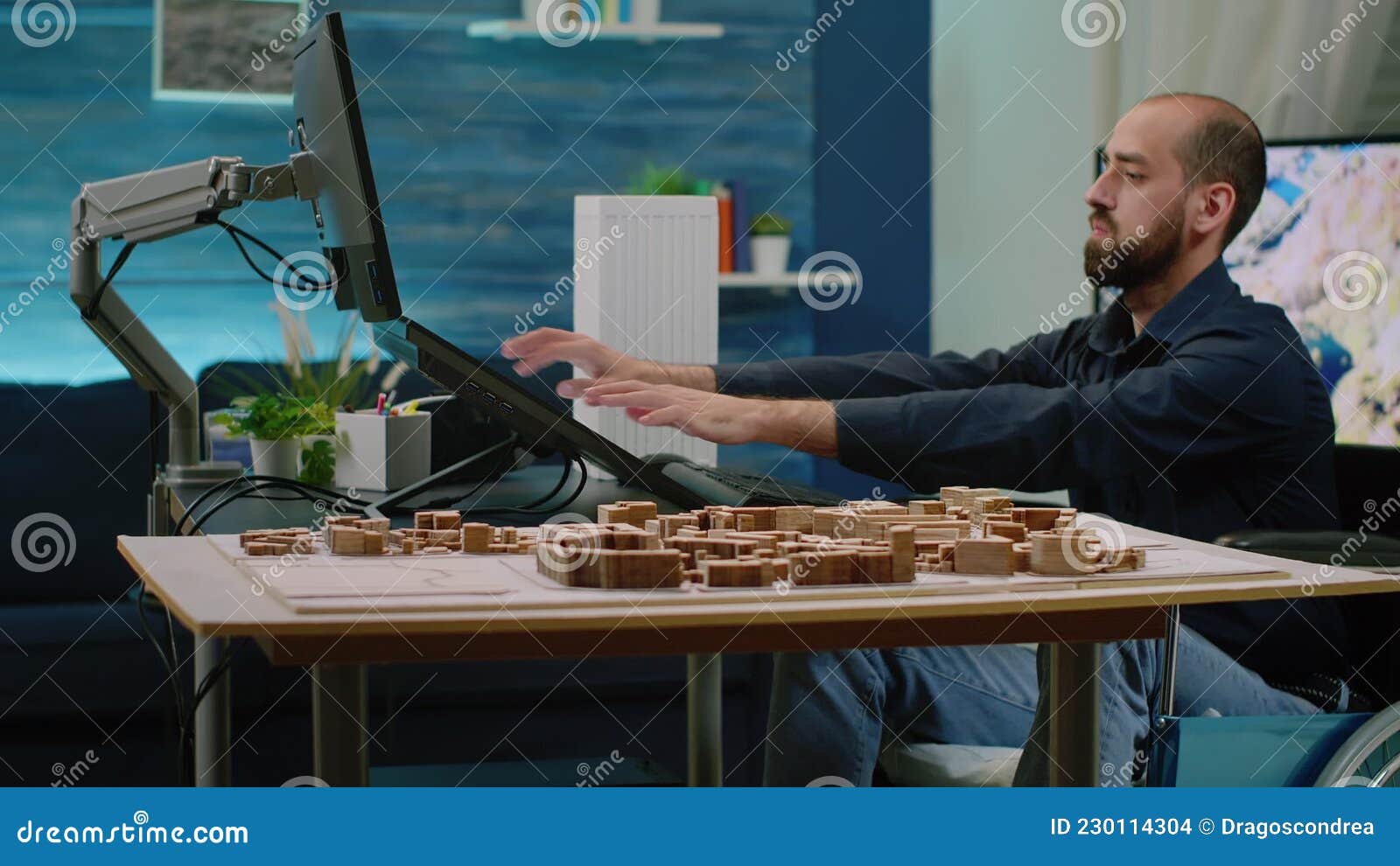 Disabled Architect Using Touch Screen Monitor for Construction Stock ...