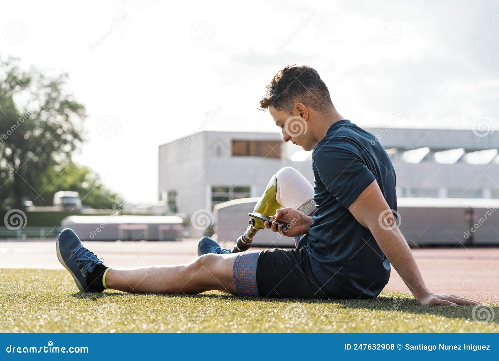 Disabled Athlete Sitting Using Phone Stock Photo - Image of amputation ...