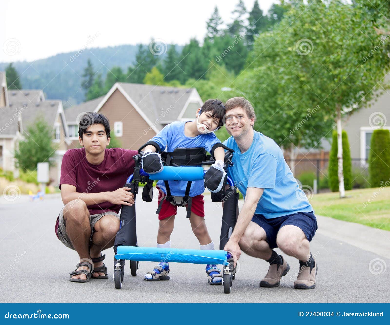 Disabled Boy in Walker, with Father and Brother Stock Photo - Image of ...