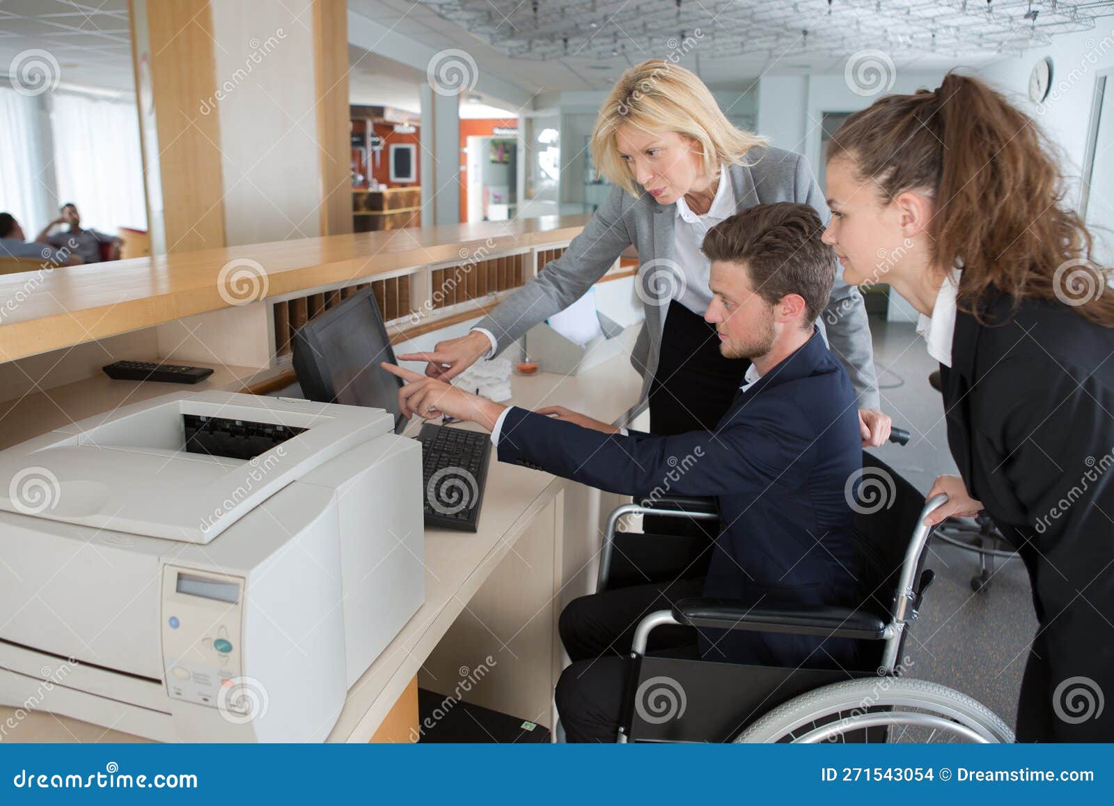 Disabled Businessman in Wheelchair Working at Reception Stock Photo ...