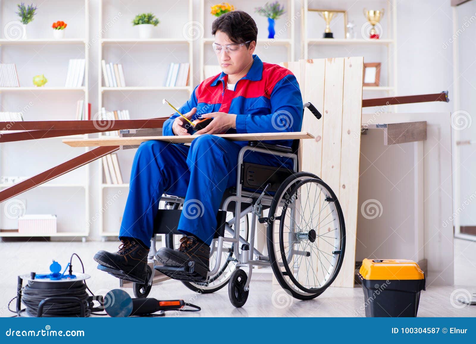 The Disabled Carpenter Taking Measurement in Workshop Stock Image ...
