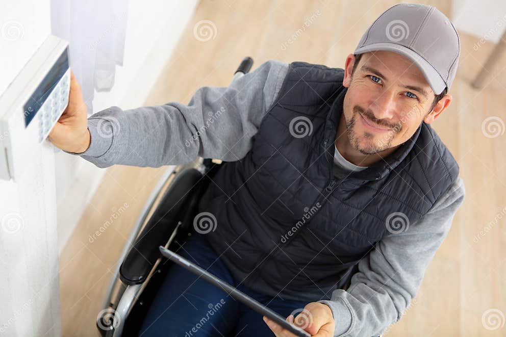 Disabled Electrician Installing Alarm System Stock Photo - Image of ...