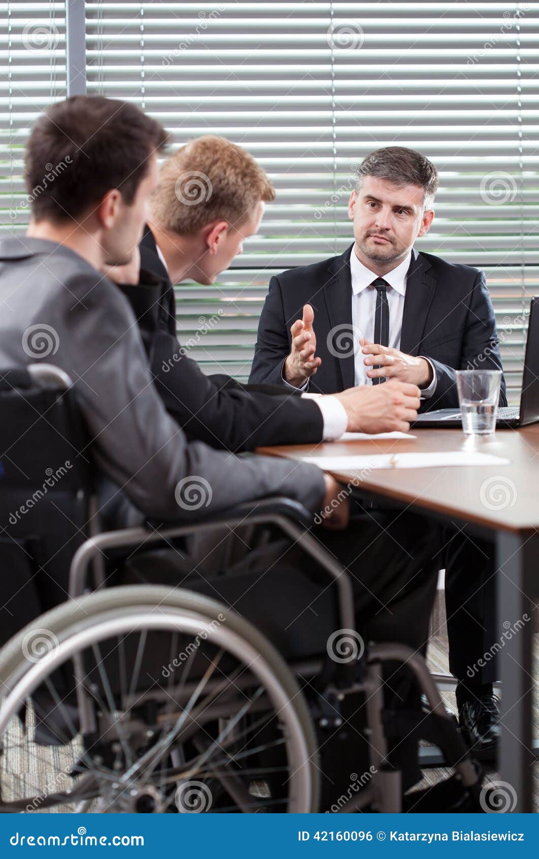 Disabled Employee Next To Conference Table Stock Photo - Image of ...