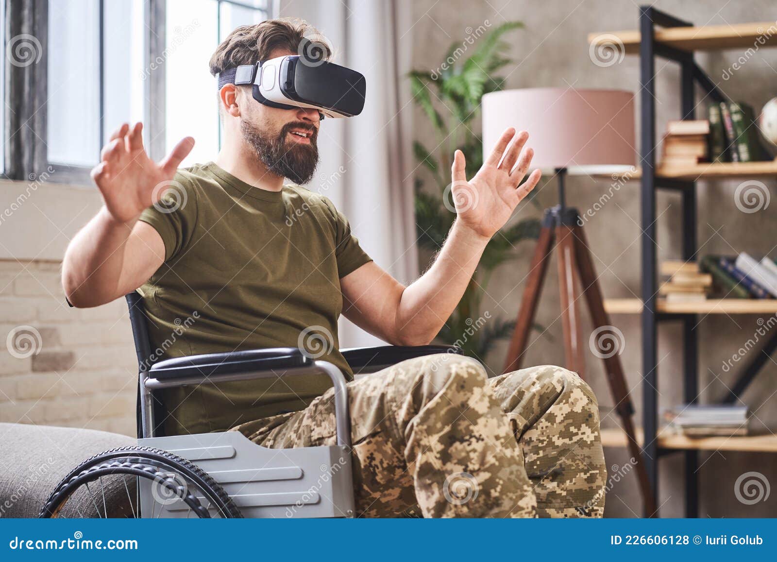 Disabled Ex-serviceman in a Wheelchair Using a VR Headset Stock Photo ...