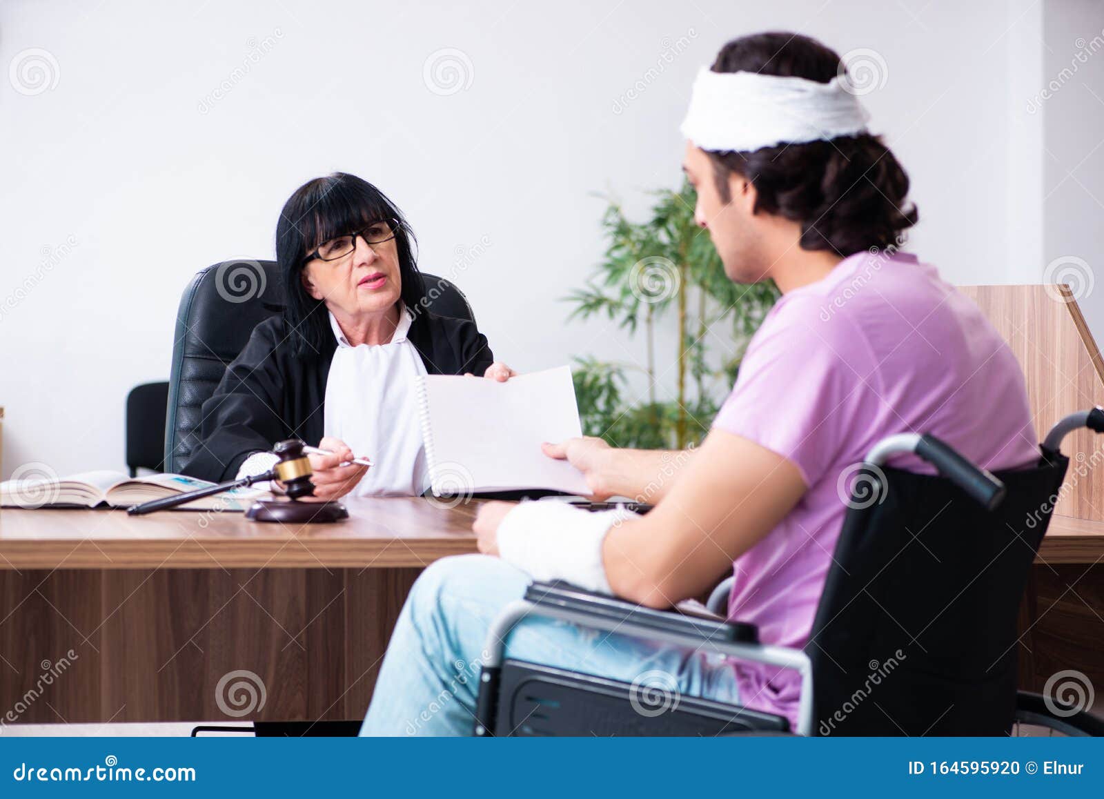 Disabled Man Consulting Judge for Damages Litigation Stock Photo ...
