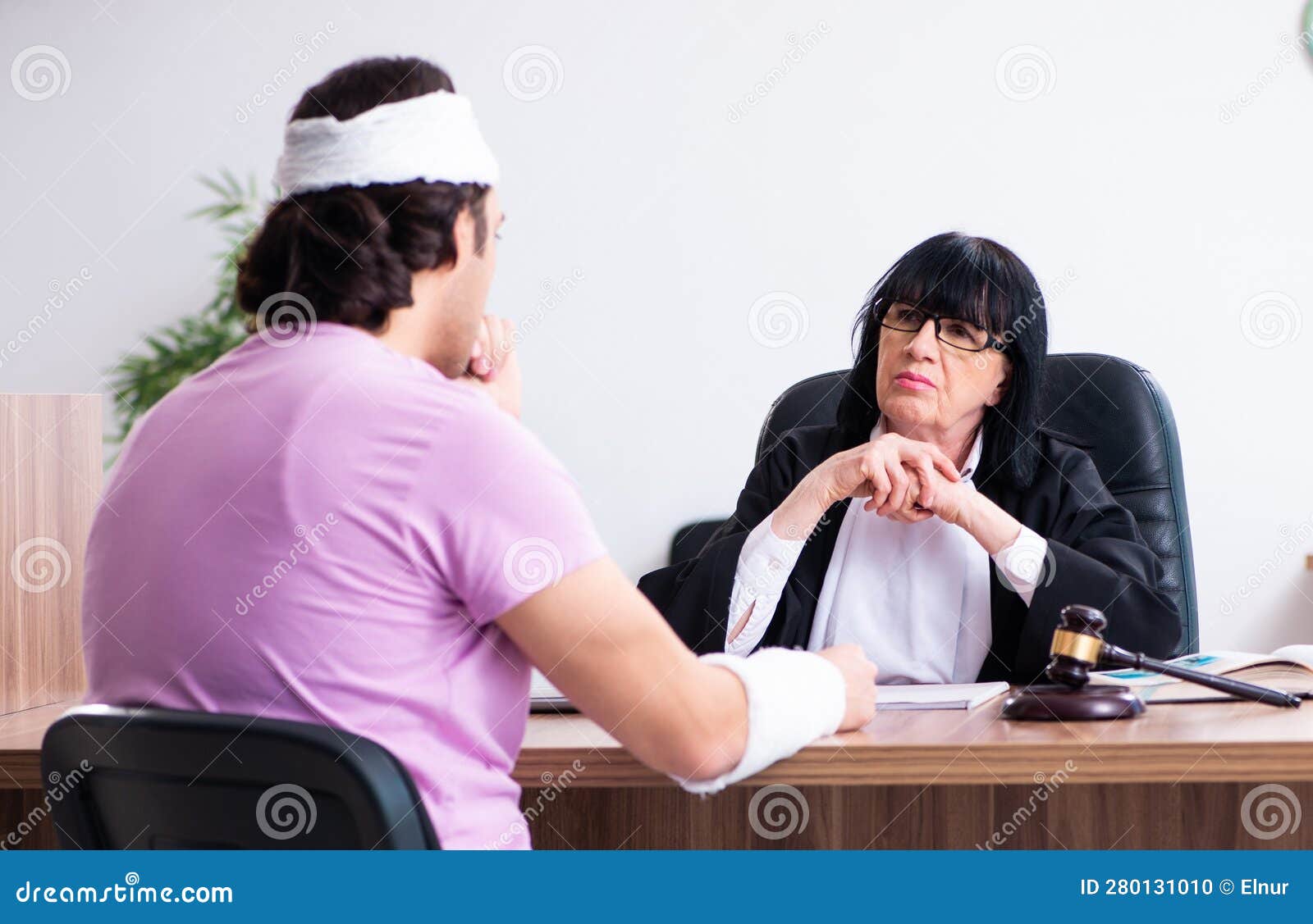 Disabled Man Consulting Judge for Damages Litigation Stock Photo ...