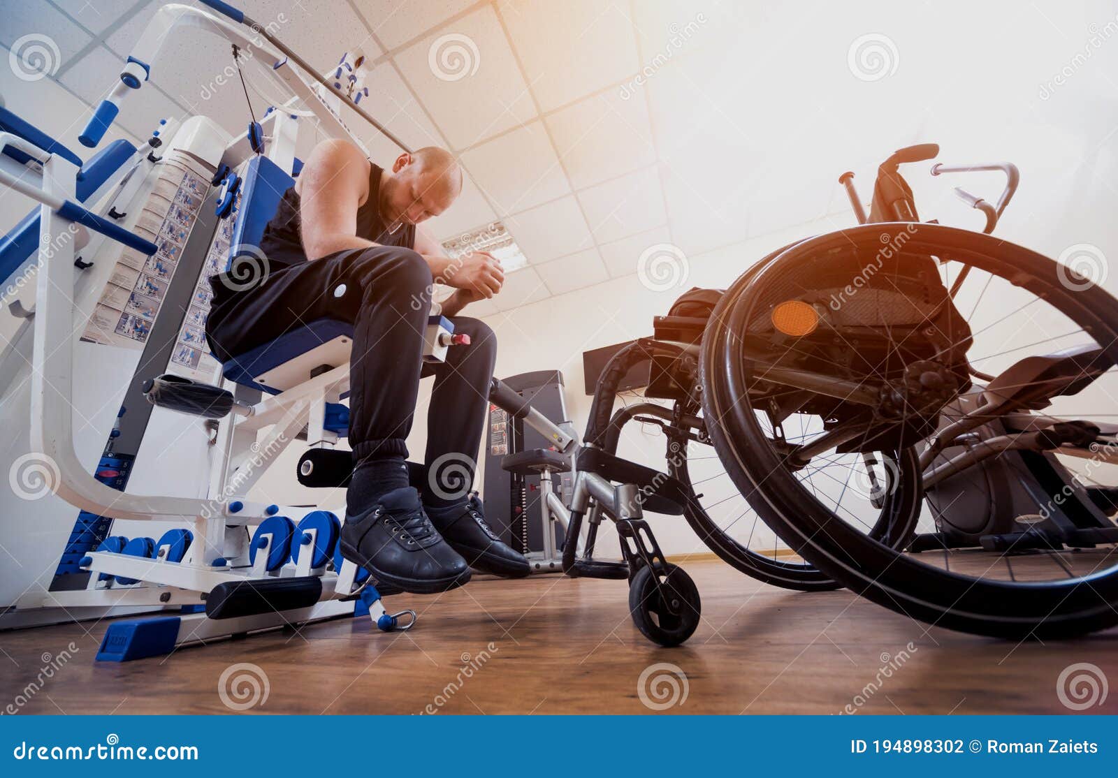 Disabled Man Doing Strength Exercises Separate from the Wheelchair ...