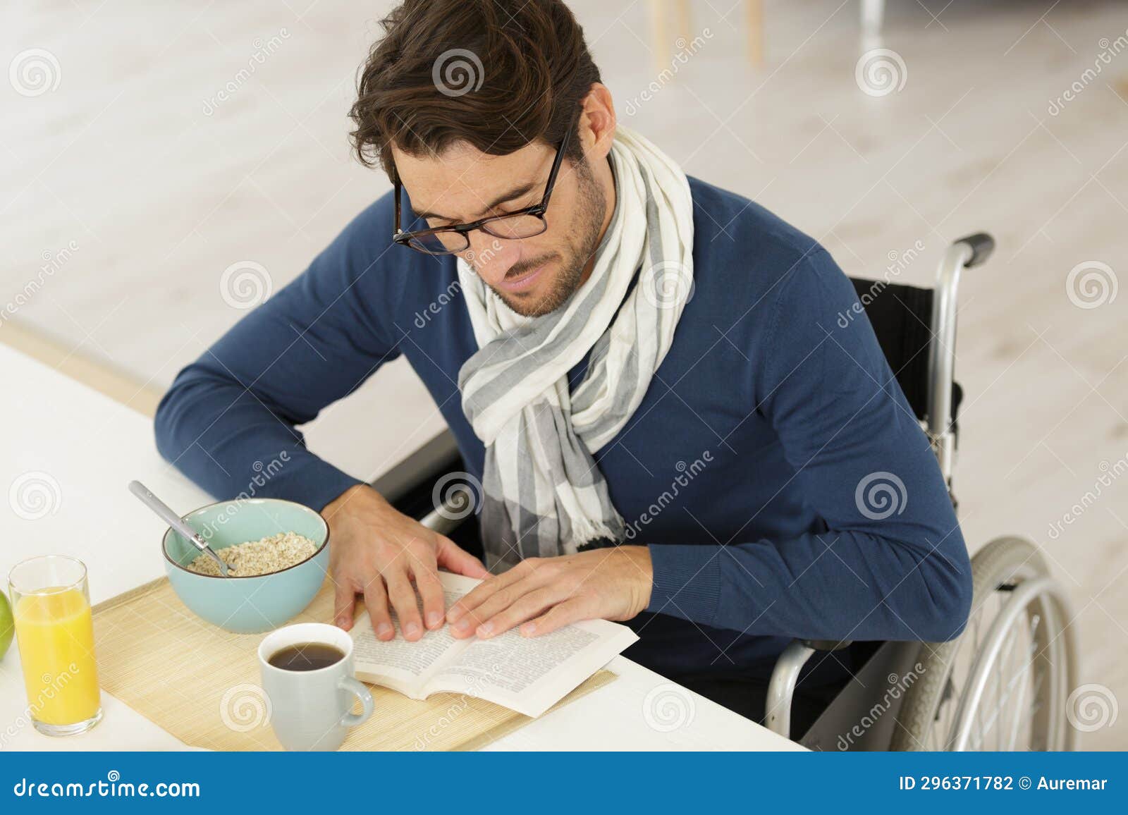 Disabled Man Having Breakfast Reading Book Stock Photo - Image of study ...
